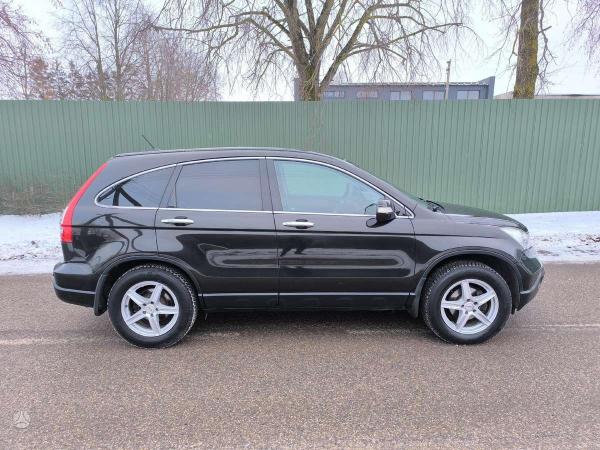 Brown Honda CR-V 2009 in Marijampole, with an engine capacity of 2.20 L and mileage of 298 thousand km for 4850 €, photo 6 on AUTOMOTO.COM.LV