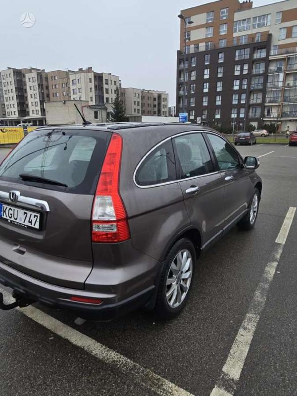 Brown Honda CR-V 2010 in Vilnius, with an engine capacity of 2.20 L and mileage of 272 thousand km for 4300 €, photo 6 on AUTOMOTO.COM.LV
