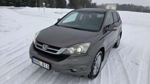 Brown Honda CR-V 2010 in Utena, with an engine capacity of 2.20 L and mileage of 287 thousand km for 6450 €, photo 12 on AUTOMOTO.COM.LV
