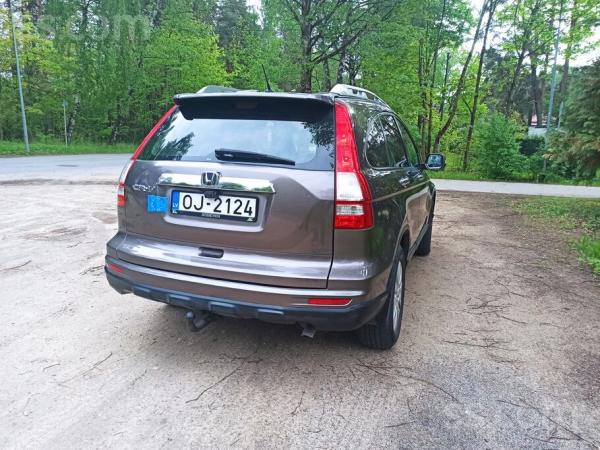 Brown Honda CR-V 2010 in Riga, with an engine capacity of 2.20 L and mileage of 156 thousand km for 7700 €, photo 6 on AUTOMOTO.COM.LV