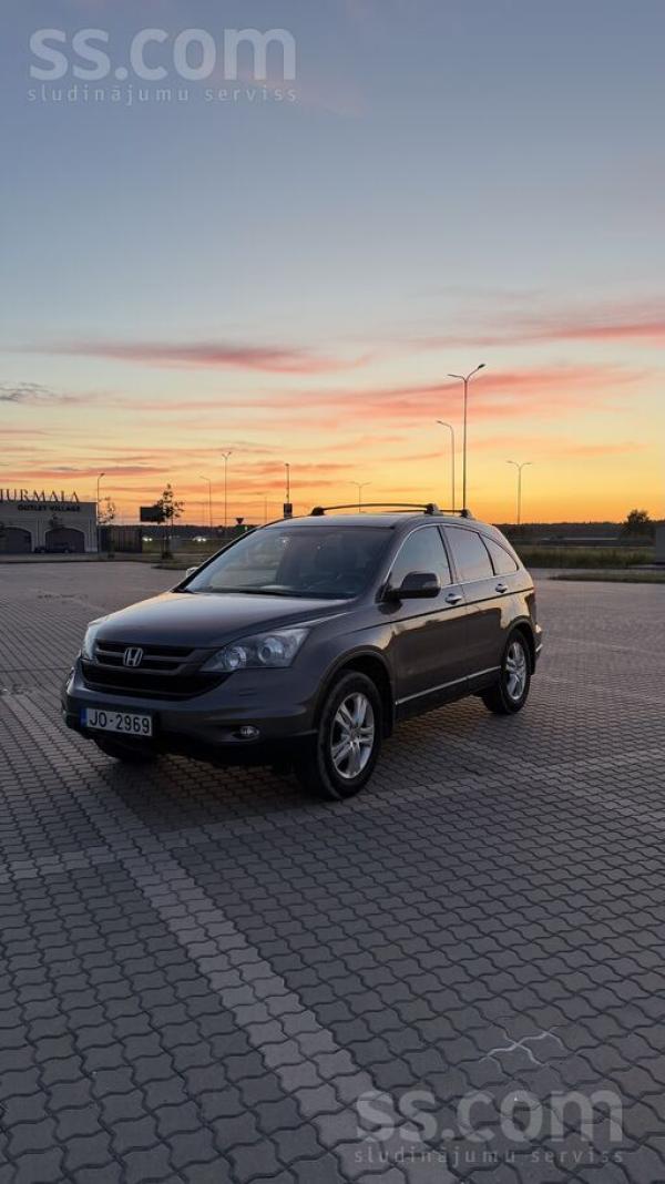Brown Honda CR-V 2010 in Riga, with an engine capacity of 2.00 L and mileage of 233 thousand km for 6200 €, photo 5 on AUTOMOTO.COM.LV
