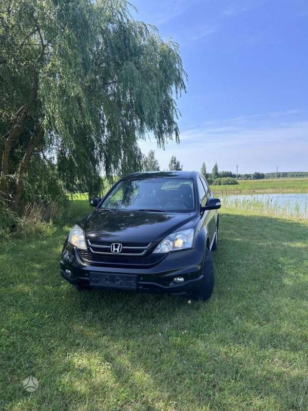 Brown Honda CR-V 2010 in Ukmerge, with an engine capacity of 2.20 L and mileage of 261 thousand km for 5600 €, photo 4 on AUTOMOTO.COM.LV