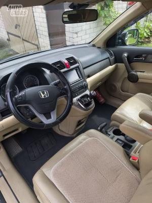 Brown Honda CR-V 2010 in Utena, with an engine capacity of 2.20 L and mileage of 341 thousand km for 5800 €, photo 16 on AUTOMOTO.COM.LV