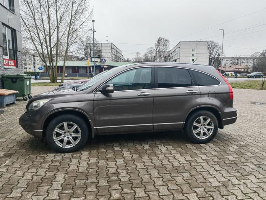 Brown Honda CR-V 2011 in Riga, with an engine capacity of 2.20 L and mileage of 216 thousand km for 7300 €, photo 2 on AUTOMOTO.COM.LV