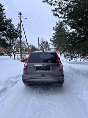 Brown Honda CR-V 2011 in Ukmerge, with an engine capacity of 2.00 L and mileage of 180 thousand km for 6300 €, photo 16 on AUTOMOTO.COM.LV