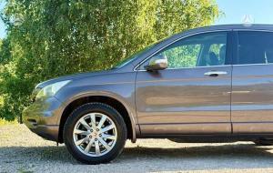 Brown Honda CR-V 2011 in Siauliai, with an engine capacity of 2.20 L and mileage of 245 thousand km for 8999 €, photo 12 on AUTOMOTO.COM.LV