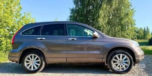 Brown Honda CR-V 2011 in Siauliai, with an engine capacity of 2.20 L and mileage of 245 thousand km for 8999 €, photo 16 on AUTOMOTO.COM.LV