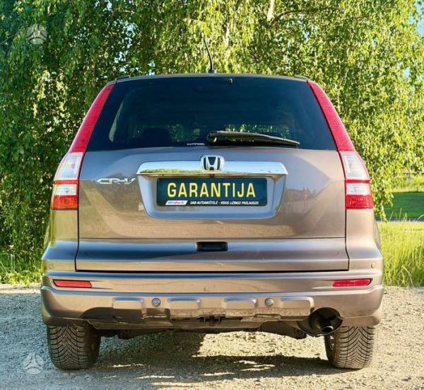 Brown Honda CR-V 2011 in Siauliai, with an engine capacity of 2.20 L and mileage of 245 thousand km for 8999 €, photo 6 on AUTOMOTO.COM.LV