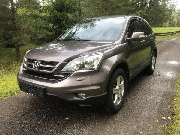 Brown Honda CR-V 2011 in Utena, with an engine capacity of 2.20 L and mileage of 263 thousand km for 5700 €, photo 1 on AUTOMOTO.COM.LV