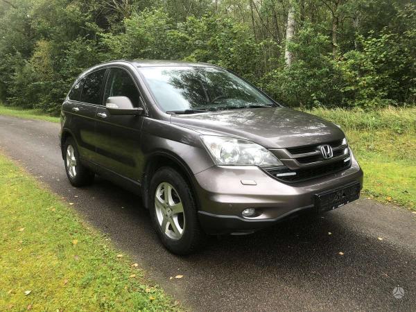 Brown Honda CR-V 2011 in Utena, with an engine capacity of 2.20 L and mileage of 263 thousand km for 5700 €, photo 5 on AUTOMOTO.COM.LV