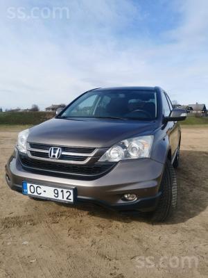 Brown Honda CR-V 2012 in Daugavpils, with an engine capacity of 2.20 L and mileage of 234 thousand km for 14000 €, photo 1 on AUTOMOTO.COM.LV