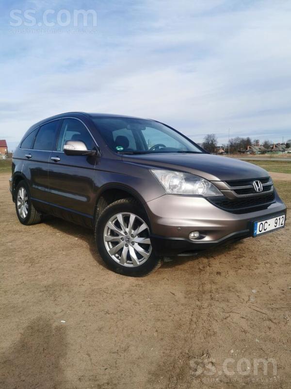 Brown Honda CR-V 2012 in Daugavpils, with an engine capacity of 2.20 L and mileage of 234 thousand km for 14000 €, photo 4 on AUTOMOTO.COM.LV