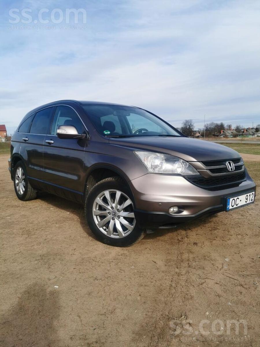 Brown Honda CR-V 2012 in Daugavpils, with an engine capacity of 2.20 L and mileage of 234 thousand km for 14000 €, photo 4 on AUTOMOTO.COM.LV