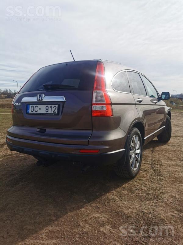 Brown Honda CR-V 2012 in Daugavpils, with an engine capacity of 2.20 L and mileage of 234 thousand km for 14000 €, photo 5 on AUTOMOTO.COM.LV