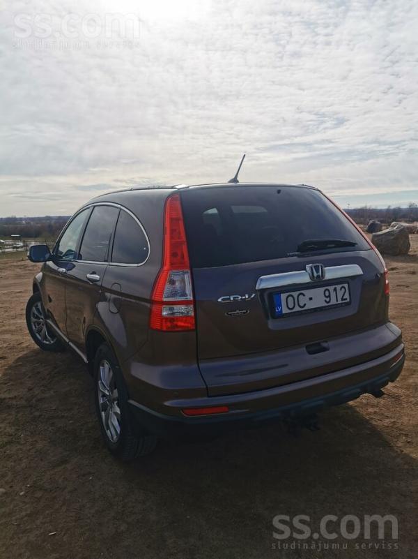 Brown Honda CR-V 2012 in Daugavpils, with an engine capacity of 2.20 L and mileage of 234 thousand km for 14000 €, photo 6 on AUTOMOTO.COM.LV