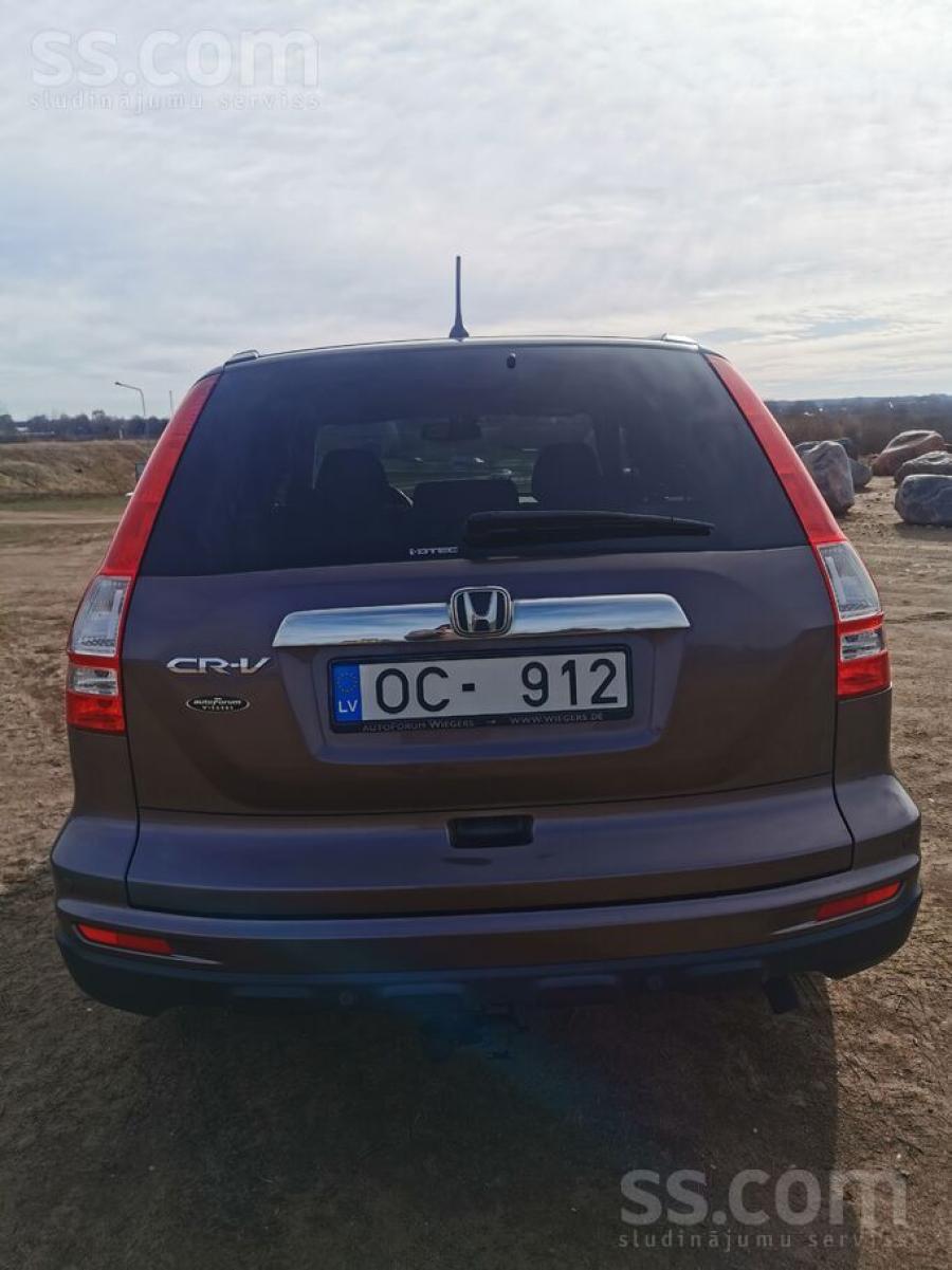 Brown Honda CR-V 2012 in Daugavpils, with an engine capacity of 2.20 L and mileage of 234 thousand km for 14000 €, photo 7 on AUTOMOTO.COM.LV