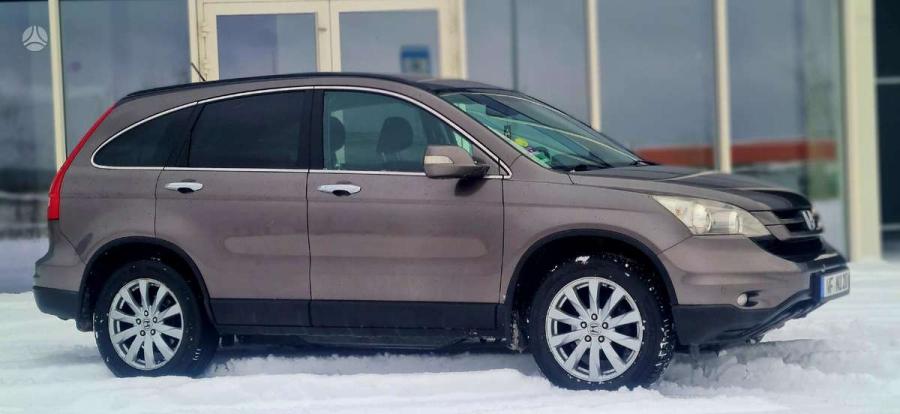 Brown Honda CR-V 2012 in Vilnius, with an engine capacity of 2.20 L and mileage of 248 thousand km for 8250 €, photo 7 on AUTOMOTO.COM.LV