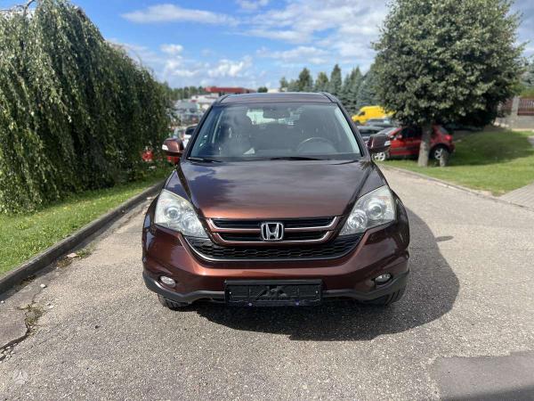 Brown Honda CR-V 2012 in Utena, with an engine capacity of 2.20 L and mileage of 250 thousand km for 7300 €, photo 2 on AUTOMOTO.COM.LV