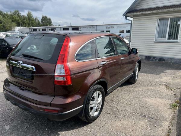Brown Honda CR-V 2012 in Utena, with an engine capacity of 2.20 L and mileage of 250 thousand km for 7300 €, photo 6 on AUTOMOTO.COM.LV