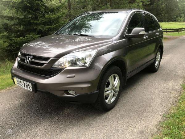 Brown Honda CR-V 2012 in Utena, with an engine capacity of 2.20 L and mileage of 270 thousand km for 6300 €, photo 3 on AUTOMOTO.COM.LV