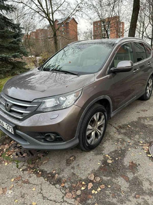 Brown Honda CR-V 2013 in Vilnius, with an engine capacity of 2.20 L and mileage of 240 thousand km for 11800 €, photo 1 on AUTOMOTO.COM.LV