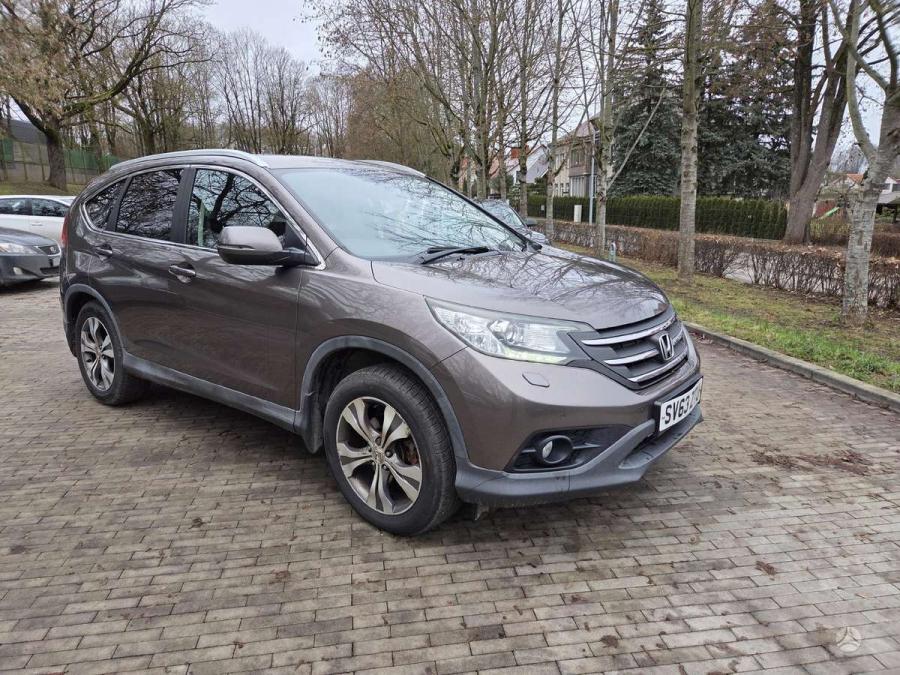 Brown Honda CR-V 2013 in Siauliai, with an engine capacity of 2.20 L and mileage of 179 thousand km for 3290 €, photo 1 on AUTOMOTO.COM.LV