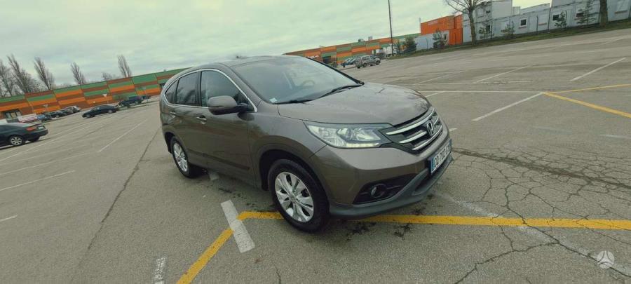 Brown Honda CR-V 2013 in Klaipeda, with an engine capacity of 2.20 L and mileage of 201 thousand km for 9400 €, photo 1 on AUTOMOTO.COM.LV