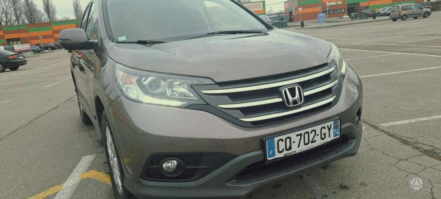 Brown Honda CR-V 2013 in Klaipeda, with an engine capacity of 2.20 L and mileage of 201 thousand km for 9400 €, photo 13 on AUTOMOTO.COM.LV