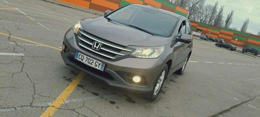 Brown Honda CR-V 2013 in Klaipeda, with an engine capacity of 2.20 L and mileage of 201 thousand km for 9400 €, photo 14 on AUTOMOTO.COM.LV