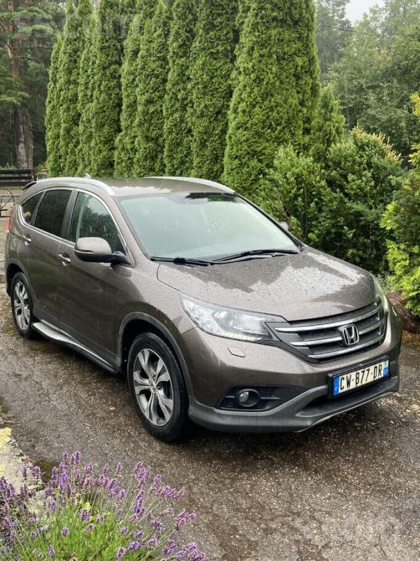 Brown Honda CR-V 2013 in Dobele, with an engine capacity of 2.20 L and mileage of 248 thousand km for 7750 €, photo 1 on AUTOMOTO.COM.LV