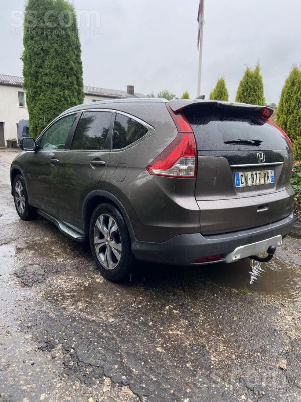Brown Honda CR-V 2013 in Dobele, with an engine capacity of 2.20 L and mileage of 248 thousand km for 7750 €, photo 4 on AUTOMOTO.COM.LV