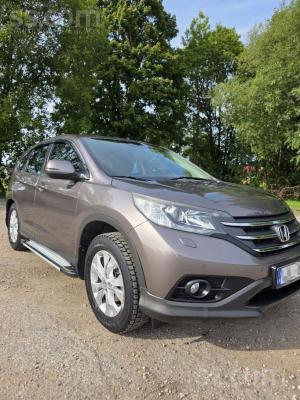Brown Honda CR-V 2013 in Saldus, with an engine capacity of 1.60 L and mileage of 102 thousand km for 9495 €, photo  on AUTOMOTO.COM.LV