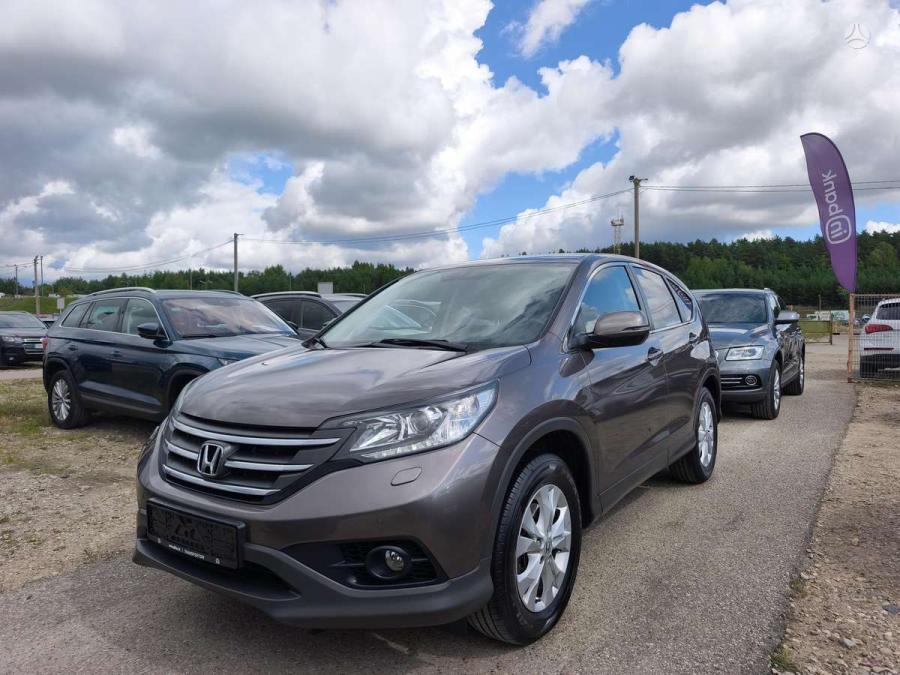 Brown Honda CR-V 2013 in Vilnius, with an engine capacity of 2.20 L and mileage of 221 thousand km for 9950 €, photo 1 on AUTOMOTO.COM.LV