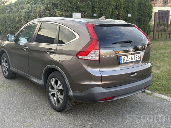 Brown Honda CR-V 2013 in Riga, with an engine capacity of 2.20 L and mileage of 209 thousand km for 10500 €, photo 1 on AUTOMOTO.COM.LV
