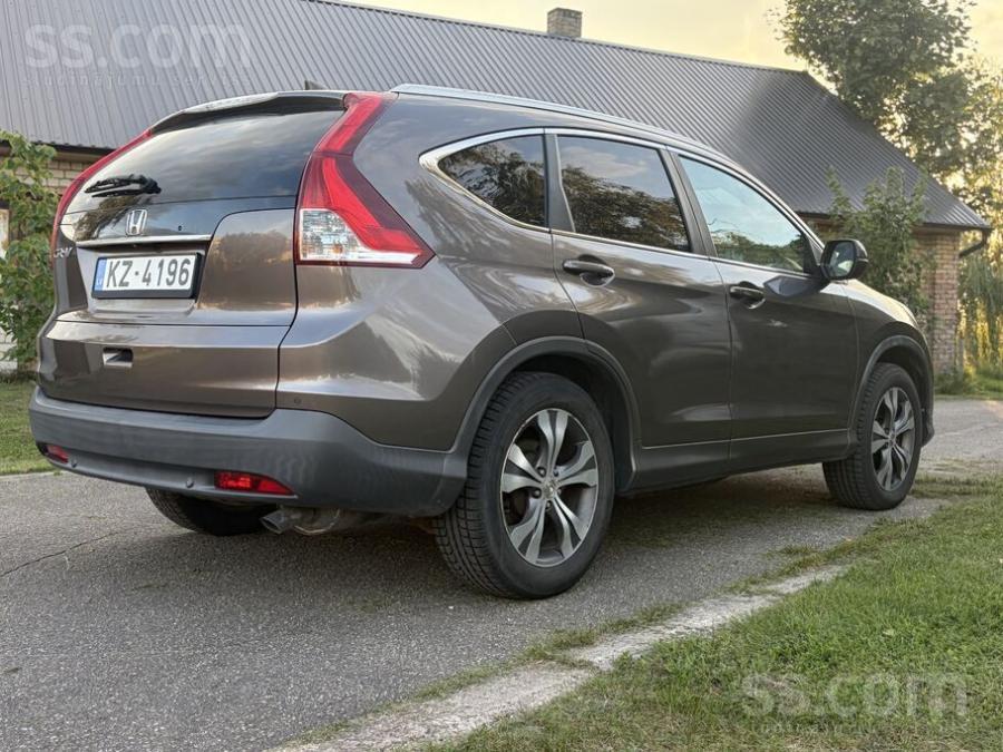 Brown Honda CR-V 2013 in Riga, with an engine capacity of 2.20 L and mileage of 209 thousand km for 10500 €, photo 3 on AUTOMOTO.COM.LV