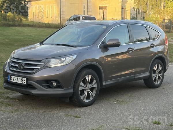 Brown Honda CR-V 2013 in Riga, with an engine capacity of 2.20 L and mileage of 209 thousand km for 10500 €, photo 4 on AUTOMOTO.COM.LV