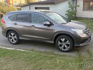 Brown Honda CR-V 2013 in Riga, with an engine capacity of 2.20 L and mileage of 209 thousand km for 10500 €, photo 5 on AUTOMOTO.COM.LV