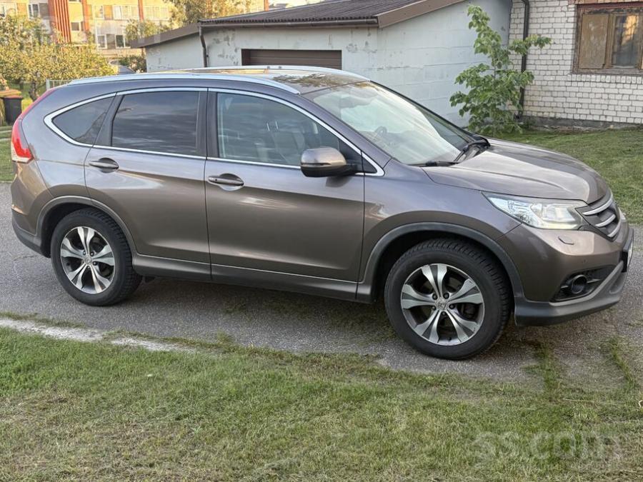 Brown Honda CR-V 2013 in Riga, with an engine capacity of 2.20 L and mileage of 209 thousand km for 10500 €, photo 5 on AUTOMOTO.COM.LV