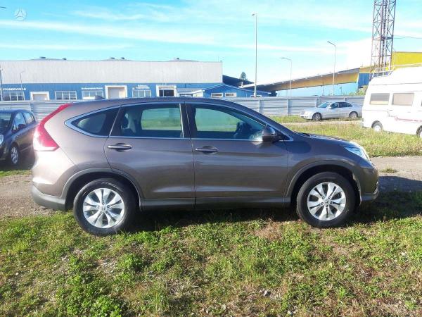 Brown Honda CR-V 2013 in Siauliai, with an engine capacity of 2.20 L and mileage of 176 thousand km for 8200 €, photo 6 on AUTOMOTO.COM.LV
