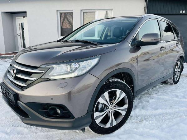 Brown Honda CR-V 2014 in Trakai, with an engine capacity of 2.00 L and mileage of 286 thousand km for 7890 €, photo 1 on AUTOMOTO.COM.LV