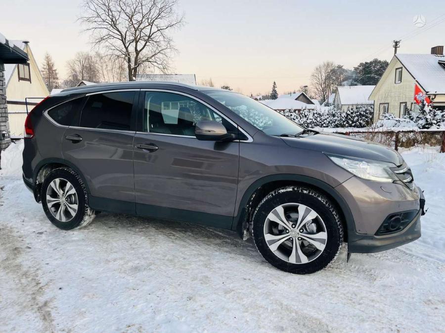 Brown Honda CR-V 2014 in Trakai, with an engine capacity of 2.00 L and mileage of 286 thousand km for 7890 €, photo 5 on AUTOMOTO.COM.LV