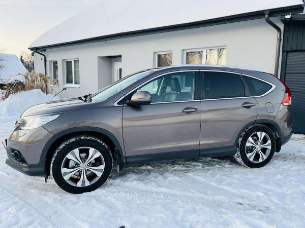 Brown Honda CR-V 2014 in Trakai, with an engine capacity of 2.00 L and mileage of 286 thousand km for 7890 €, photo 9 on AUTOMOTO.COM.LV
