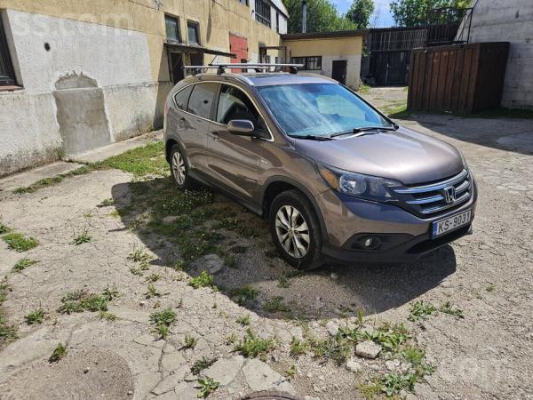Brūns Honda CR-V 2014 Rīga, ar dzinēja tilpumu 2.40 L un nobraukumu 135 tūkst. km par 8000 €, foto 5 vietnē AUTOMOTO.COM.LV