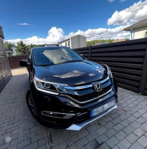 Brown Honda CR-V 2015 in Vilnius, with an engine capacity of 1.60 L and mileage of 165 thousand km for 13750 €, photo 3 on AUTOMOTO.COM.LV