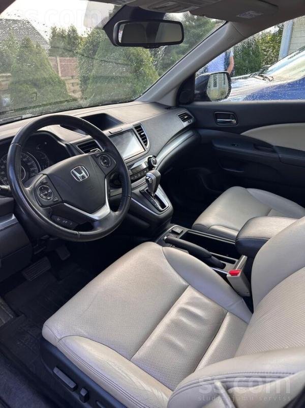 Brown Honda CR-V 2015 in Riga, with an engine capacity of 2.00 L and mileage of 195 thousand km for 13000 €, photo 9 on AUTOMOTO.COM.LV