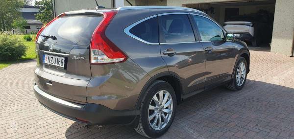 Brown Honda CR-V 2015 in Plunge, with an engine capacity of 2.35 L and mileage of 121 thousand km for 14500 €, photo 4 on AUTOMOTO.COM.LV