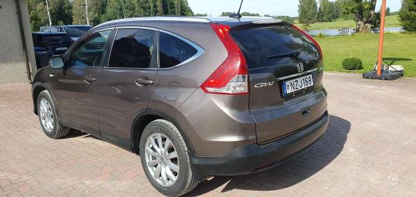 Brown Honda CR-V 2015 in Plunge, with an engine capacity of 2.35 L and mileage of 121 thousand km for 14500 €, photo 5 on AUTOMOTO.COM.LV
