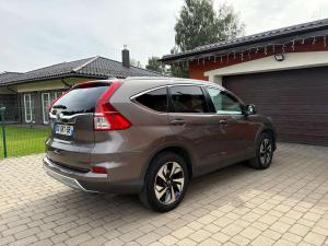Brown Honda CR-V 2015 in Vilnius, with an engine capacity of 1.60 L and mileage of 180 thousand km for 13800 €, photo 4 on AUTOMOTO.COM.LV