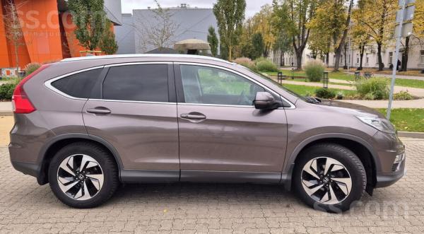 Brown Honda CR-V 2015 in Riga, with an engine capacity of 2.00 L and mileage of 123 thousand km for 15300 €, photo 5 on AUTOMOTO.COM.LV