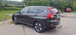 Brown Honda CR-V 2016 in Riga, with an engine capacity of 2.00 L and mileage of 196 thousand km for 15900 €, photo 5 on AUTOMOTO.COM.LV